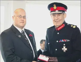Medal is delivered to cyclist postman - PressReader
