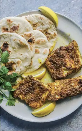 Flaky curried cod with yoghurt flatbreads - PressReader