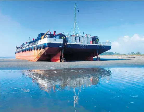 Stranded barge set for beach recovery - PressReader