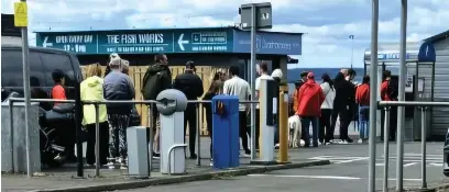 Long queues photograph­ed at car park after problems reported - PressReader