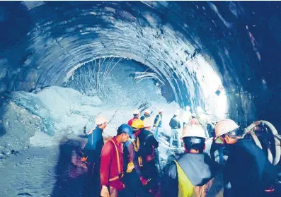 Rescuers dig to reach 40 workers trapped in collapsed road tunnel ...