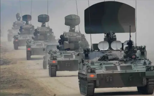 Hu flexes his new military muscle - PressReader