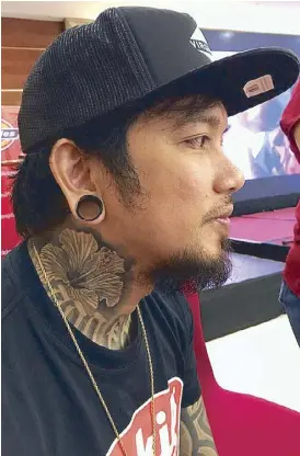 The rocker with multi-imaged tattoos - PressReader