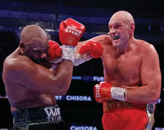 Tyson Fury blijft wereldkamp­ioen, niet in het minst als provocateu­r - PressReader