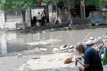Seven killed in SW China floods as Beijing triples rain death toll ...
