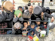 GRIPPED BY HUNGER, GAZANS QUEUE FOR MEAGER FOOD - PressReader