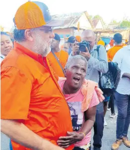 Blind woman happy to touch Golding on campaign stop - PressReader