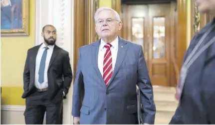 US senator remains defiant amid bribery charges - PressReader