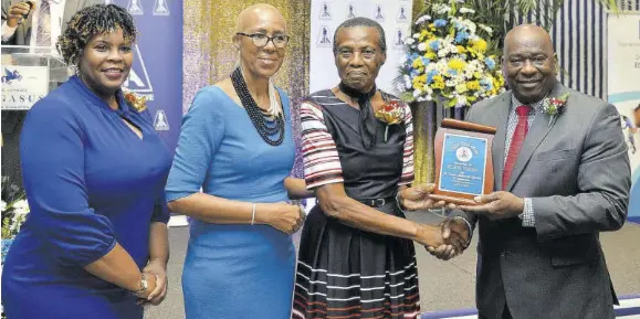 Retired educator receives Golden Torch Award for 49 years of service ...