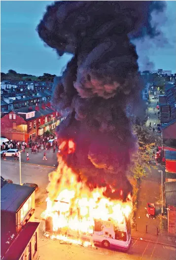 Mob torches bus and flips police car in Leeds riot - PressReader