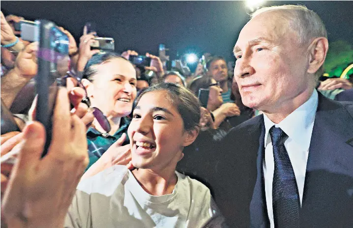 Putin draws a line under coup turmoil with a smiley face and a selfie ...