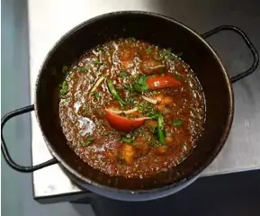 Under fire UK balti houses keep calm and curry on - PressReader