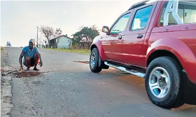 ‘Gatvol’ residents fill potholes themselves - PressReader