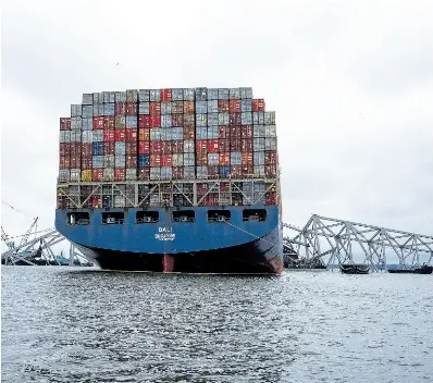First cargo vessel passes through alternate channel to collapsed ...