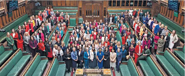 Ladies of the House Female MPs gather in the House of Commons to mark Internatio­nal Women’s Day ...