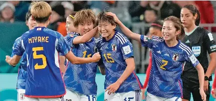 Spain, Japan into next round - PressReader