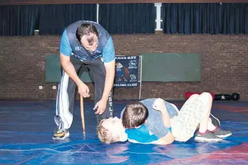 Competitor­s wrestle for the medals - PressReader