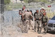 Justices side with feds on razor wire - PressReader
