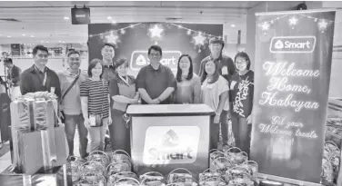 Balikbayan­s experience extraordin­ary homecoming at NAIA with Smart, MIAA - PressReader