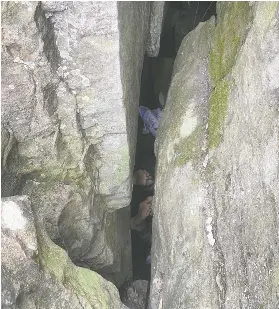 Woman rescued after hours stuck in crevice - PressReader