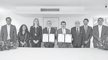 Firma la UAT convenio con empresa Woodside - PressReader