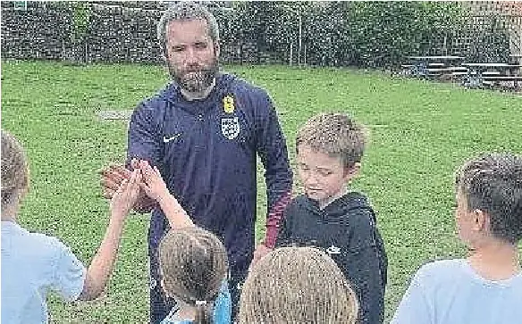 Paralympia­n and Blind England footballer Roy Turnham pays a visit to ...