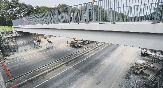 New £5 million Peterborou­gh footbridge lifted into place over A47 ...