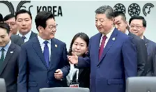 Xi takes centre stage at APEC meet, promises to defend global free ...