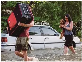 THOUSANDS FLEE AFTER UKRAINE DAM COLLAPSES - PressReader