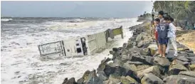 Containers from sunken ship float ashore - PressReader
