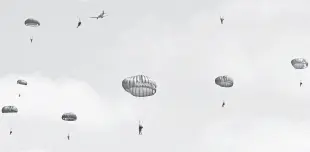 A mass parachute jump over Normandy kicks off commemorat­ions for 80th ...