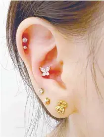 Double-edged sword of body piercings - PressReader