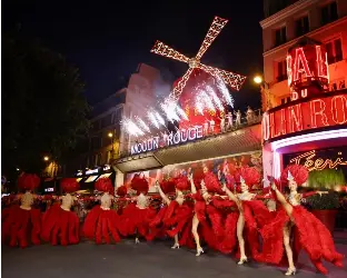 Paris rejoices as Moulin Rouge windmill sails turn again year after ...