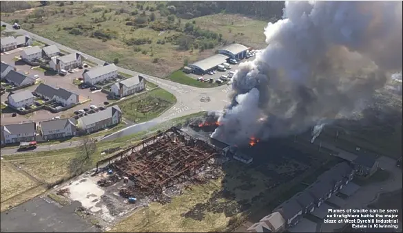 Firefighte­rs battle huge blaze at industrial estate amid warning to ...