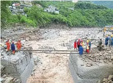 Dozens missing after fatal flooding, bridge collapse - PressReader