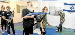ISRAELIS LEARN KRAV MAGA FIGHTING ART AMID GAZA WAR - PressReader