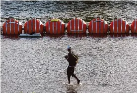 Appeals court says floating river barrier can stay — for now. - PressReader