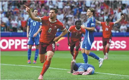 Italy out, as Swiss roll on to quarterfin­als - PressReader