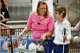 Blind, partially deaf 9-year-old boy shows off his 4-H rabbits at ...