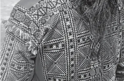 Symbols of pride worn in a dress - PressReader
