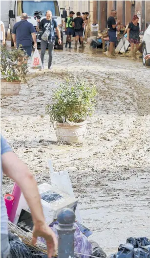 Streets of mud follow deadly downpour - PressReader