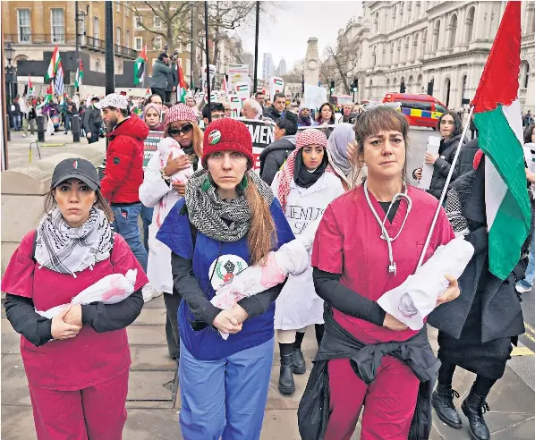 Medics’ march claims Gaza ‘genocide’ is unfolding - PressReader