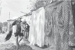 Dhobi Ghat Pulau Pinang: Daerah dobi terakhir di Malaysia - PressReader