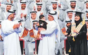 Proud mum attends graduation with baby - PressReader