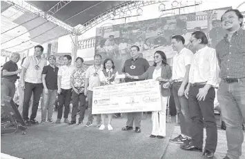 DOLE-7 turns over P30M TUPAD check to Capitol - PressReader