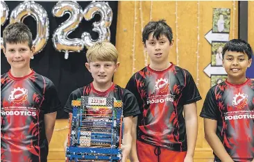 Young robot builders off overseas again - PressReader