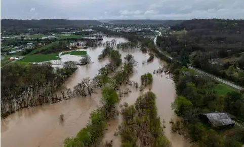 Days of severe storms leave 18 dead as rising rivers threaten US south ...