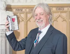 John’s MBE accolade for his heritage work - PressReader