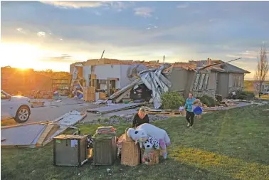 Residents sift through rubble after tornadoes - PressReader