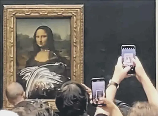 Cake thrown at the Mona Lisa in climate change protest - PressReader